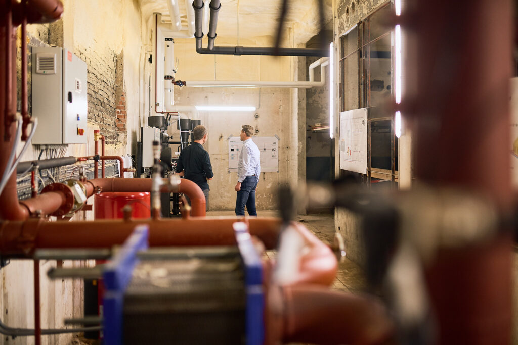 What is district heating and how does it work technically?